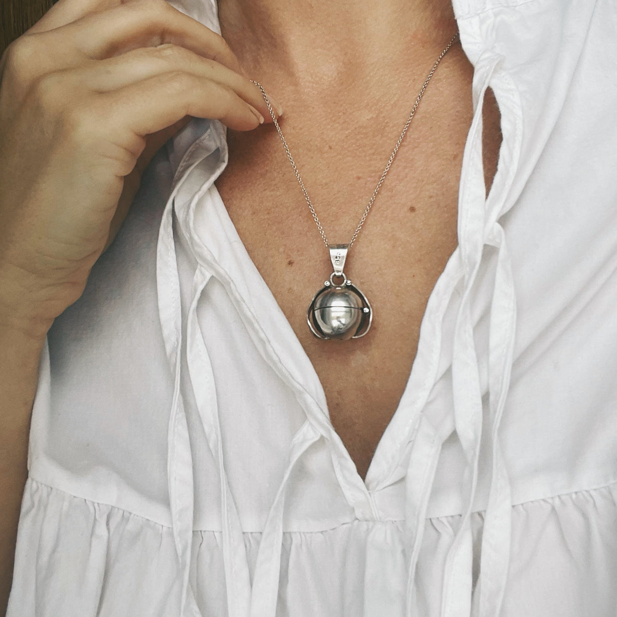 Sterling Silver Folding Orb Locket – DEAR GOLDEN